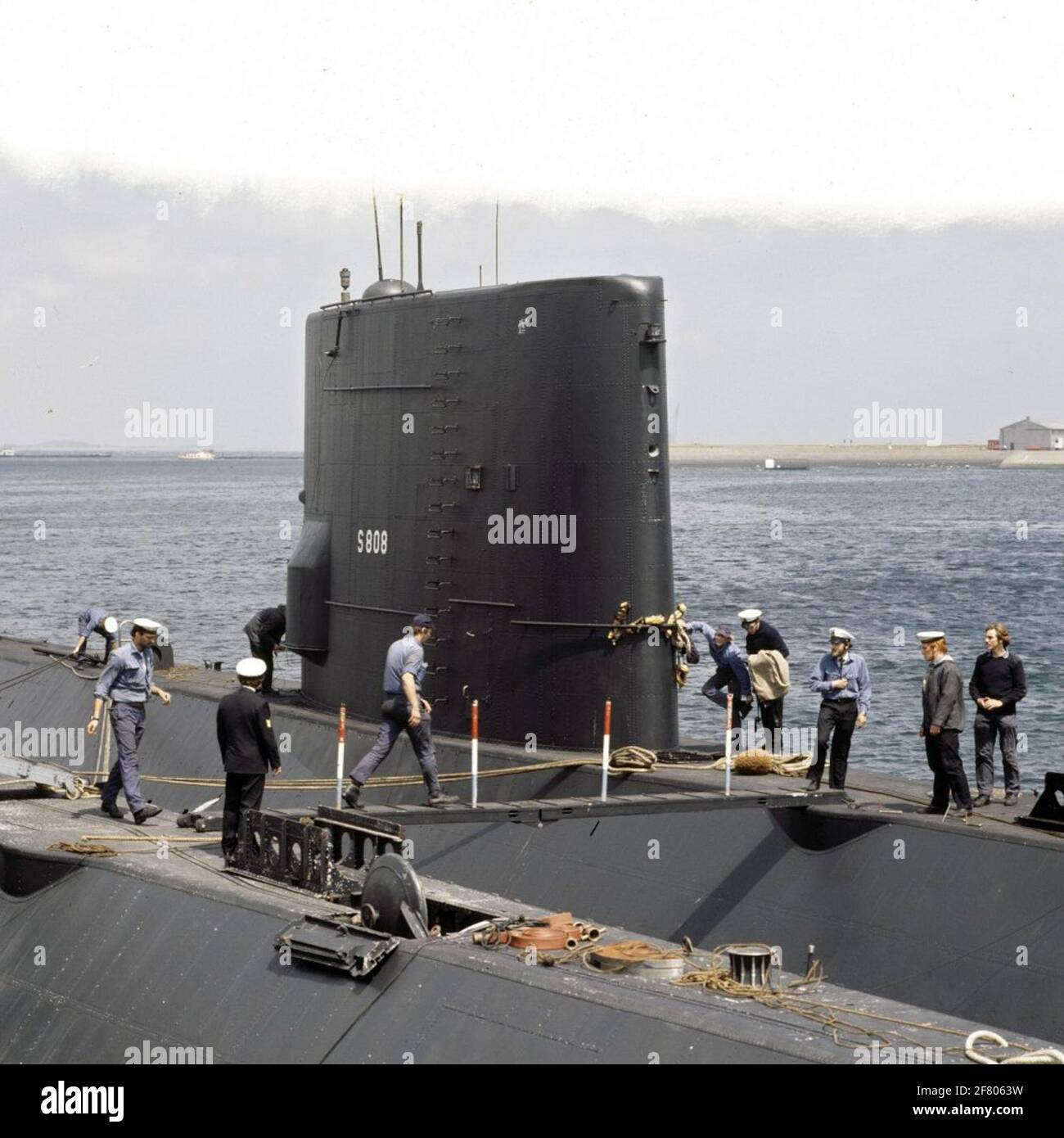 The submarine Hr.Ms. Dolphin (S 808, 1960-1985) alongside a sister ship ...