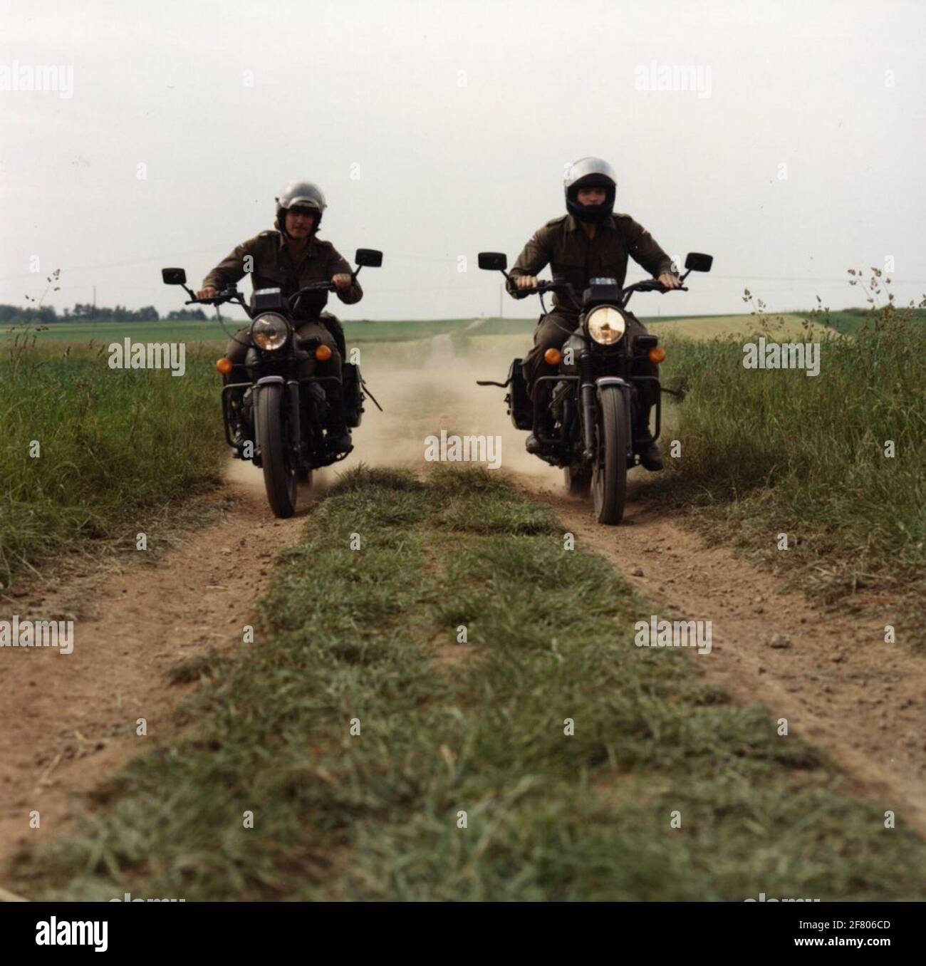 Two motorcycle dancing side by side, each on a motorcycle 'Moto Guzzi V ...