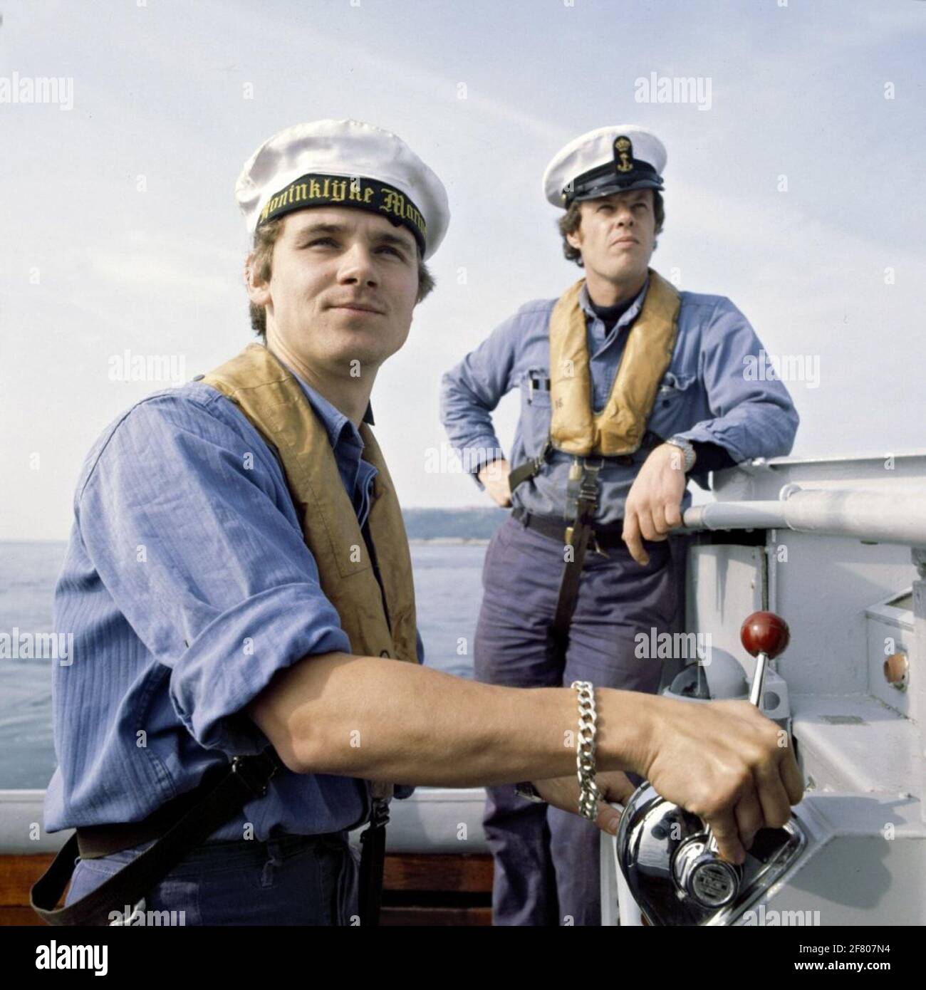 A corporal and a sailor in blue workpack with life jacket on board a ...