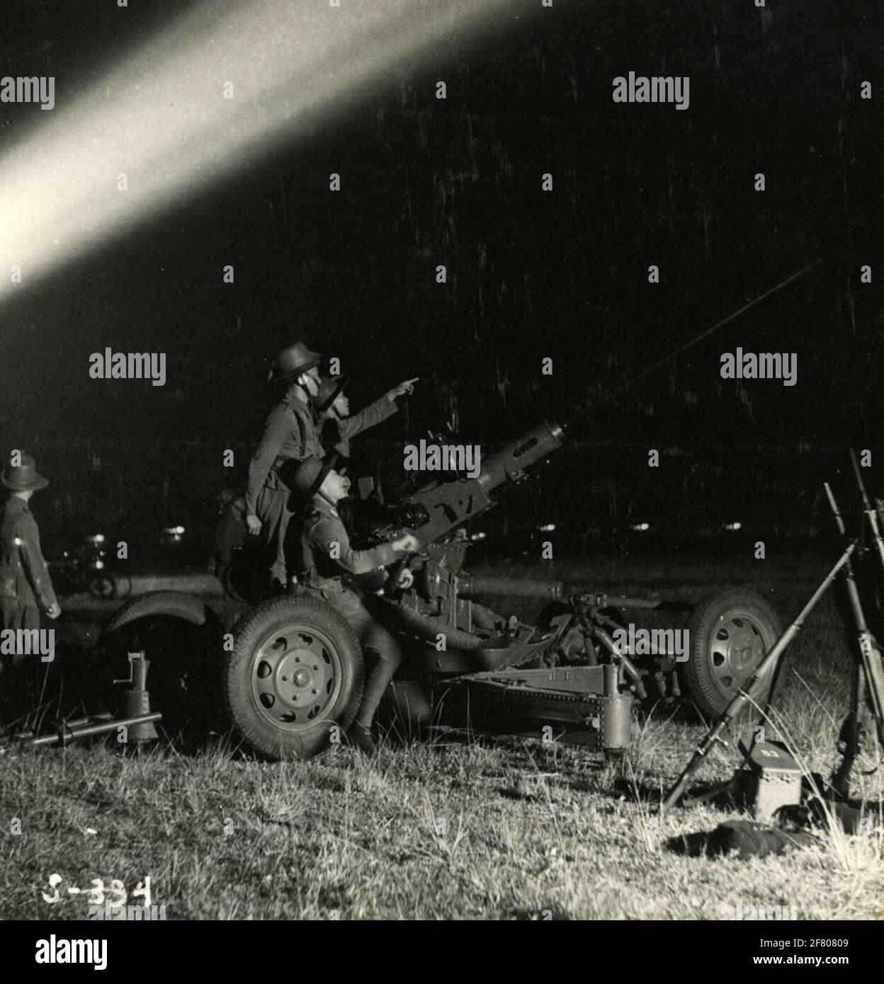 Soldiers of the Royal Dutch-Indian Army (KNIL) exercise at night with a ...