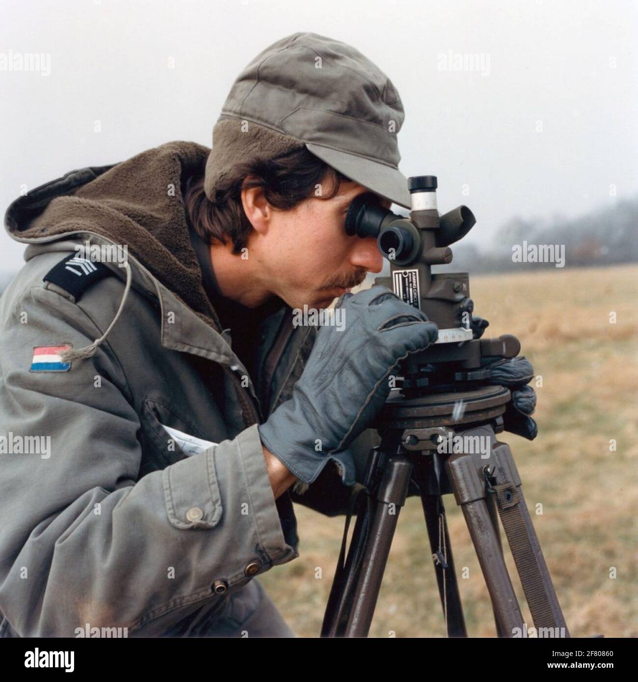 A sergeant of the first class is aligning led weapon equipment using an ...