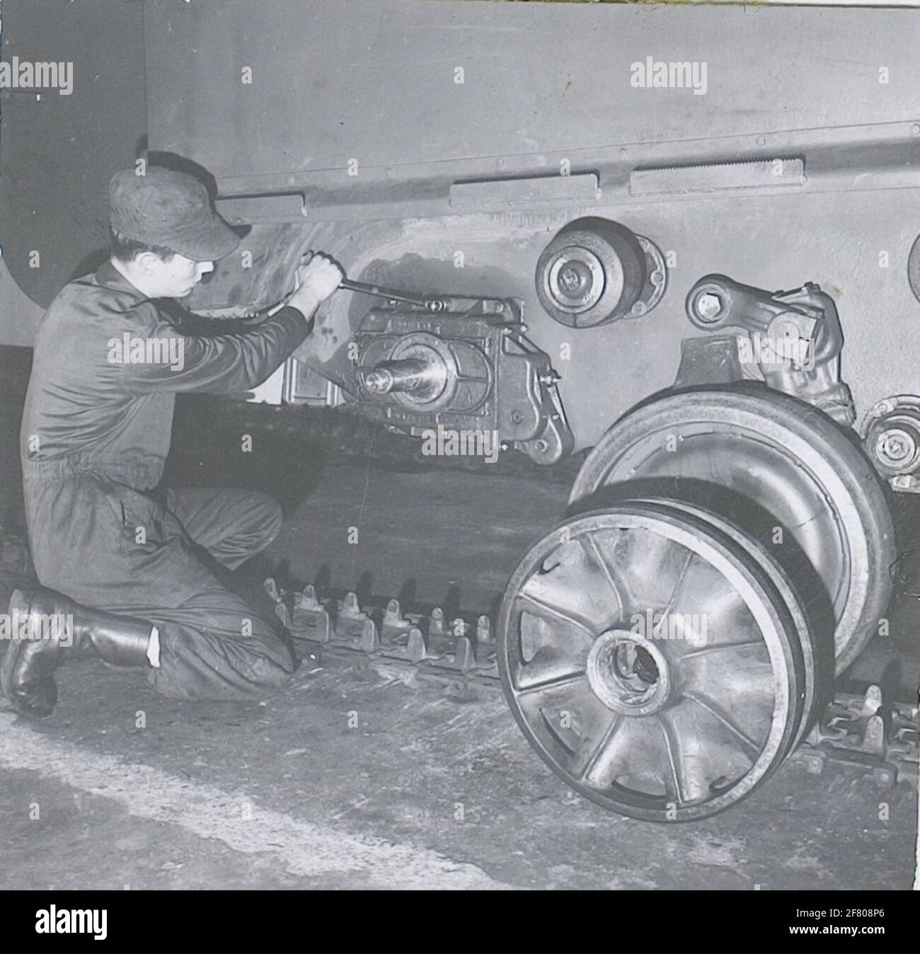A technician is locking up (or loosening) of the right span wire device ...