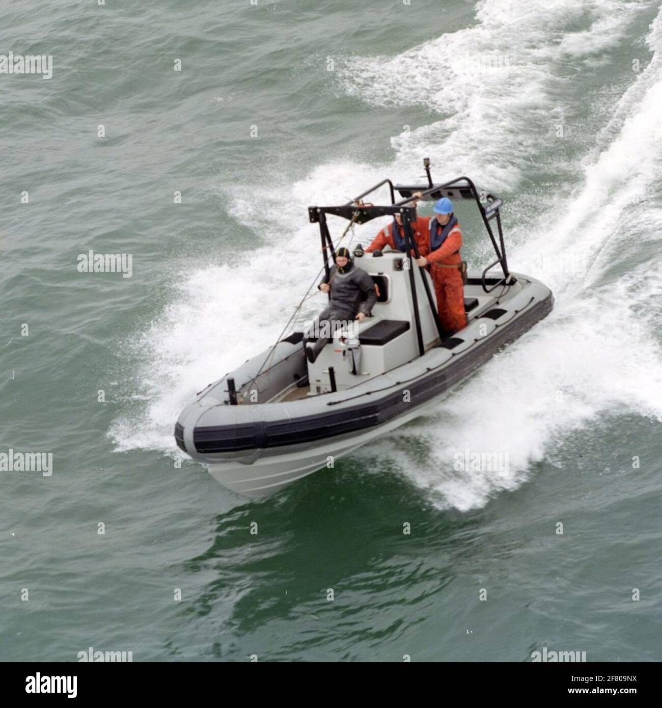 An RHIB (Rigid-Hulled Inflatable Boat) in action (March 1990 Stock ...