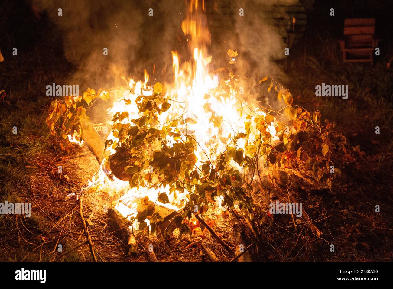 very big fire pit outside with bright orange light Stock Photo - Alamy