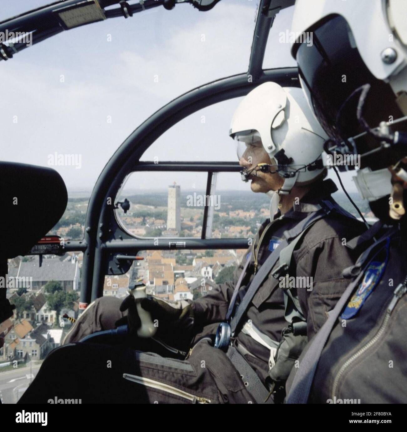 Flyer in the cockpit of an Alouette III helicopter from the SAR above ...