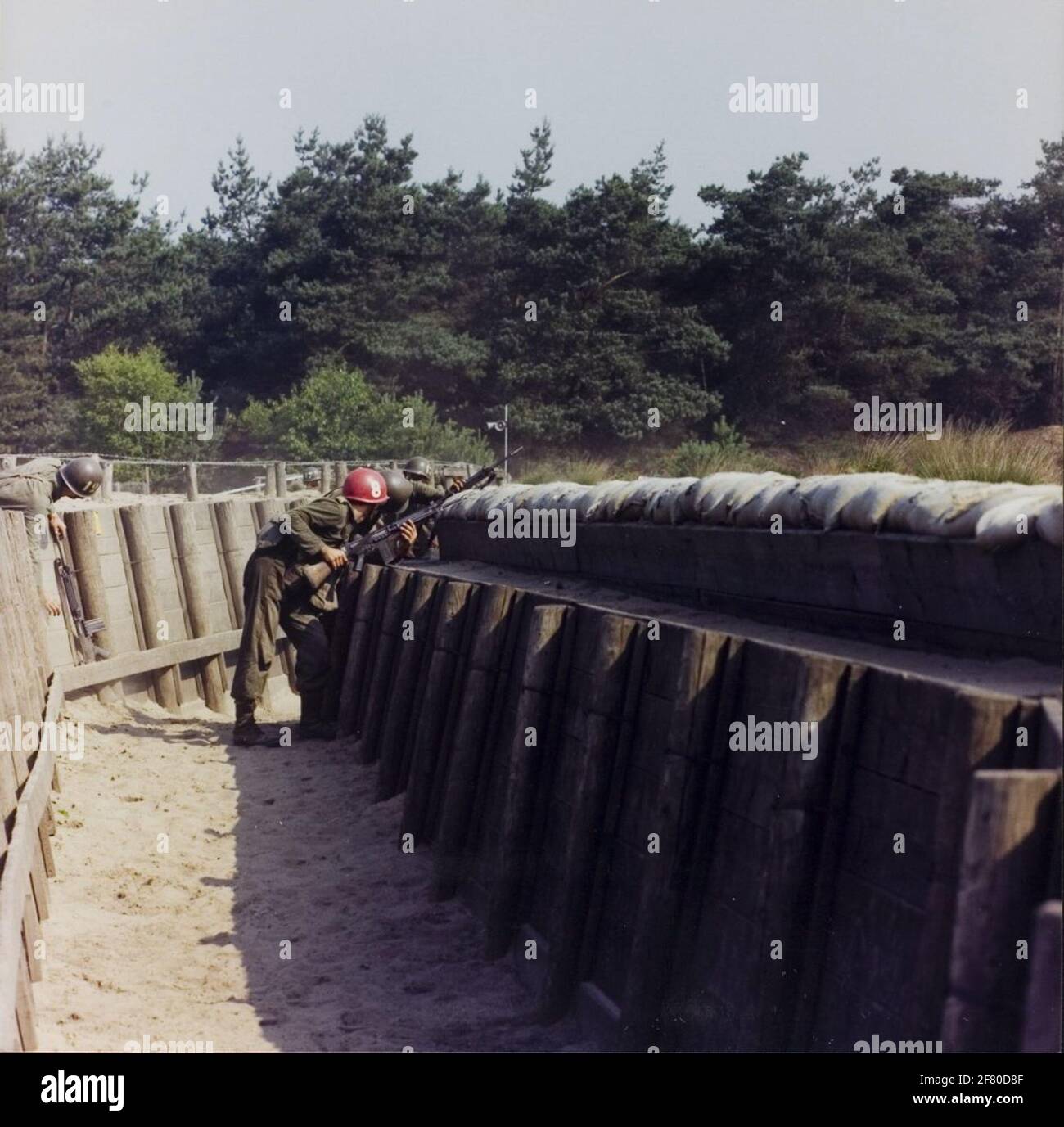 Soldiers, armed with the FAL rifle and numbered helmets, in action on ...