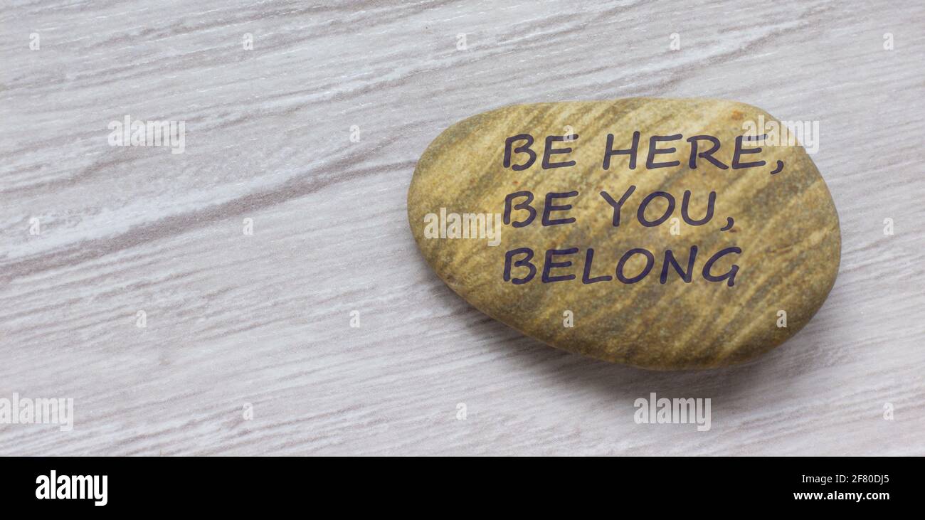 Be here, be you, belong symbol. Beautiful stone with words 'Be here, be ...