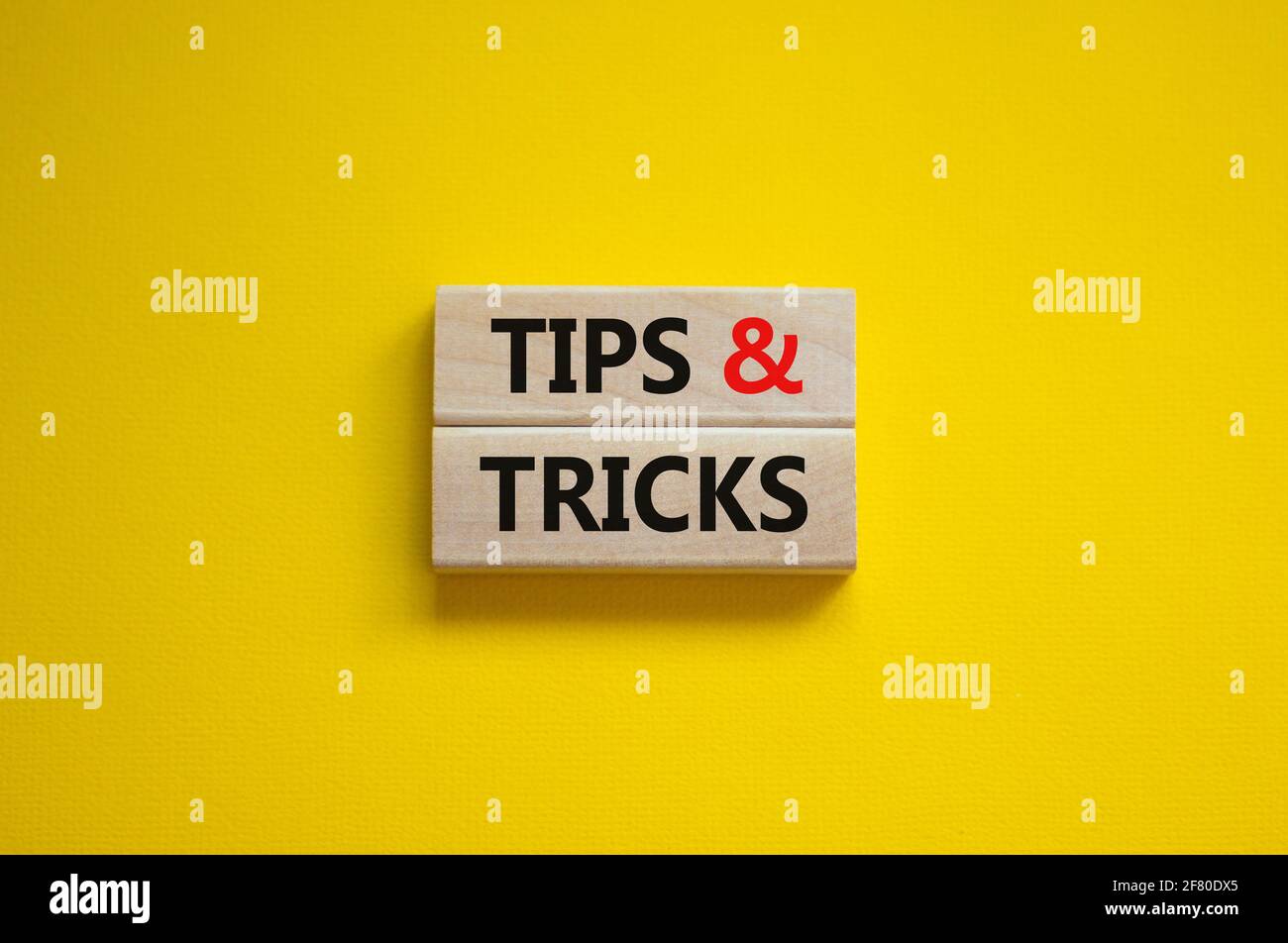 Tips and tricks symbol. Wooden blocks with words 'Tips and tricks ...