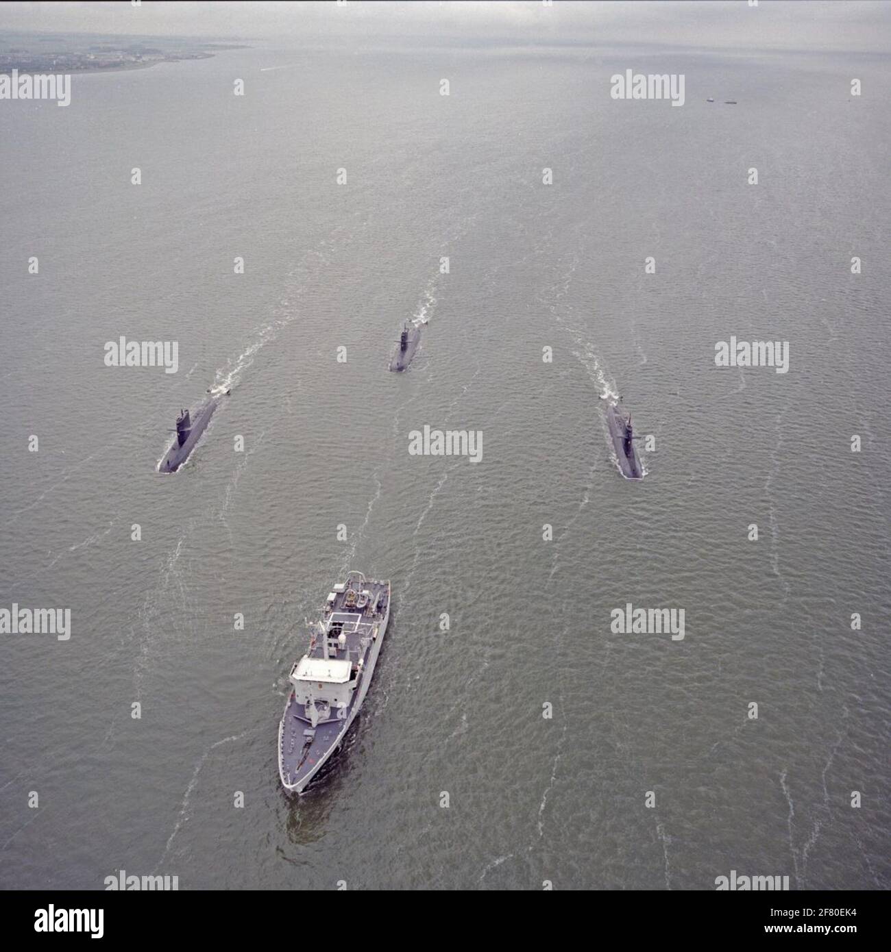 HR.MS torpedo ship ship Mercuur (1987-) followed by three submarines ...