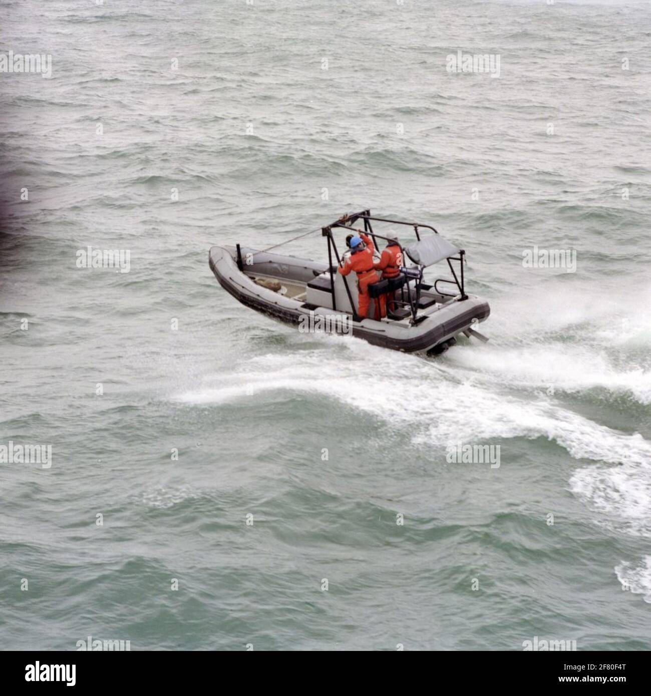 An RHIB (Rigid-Hulled Inflatable Boat) in action (March 1990 Stock ...
