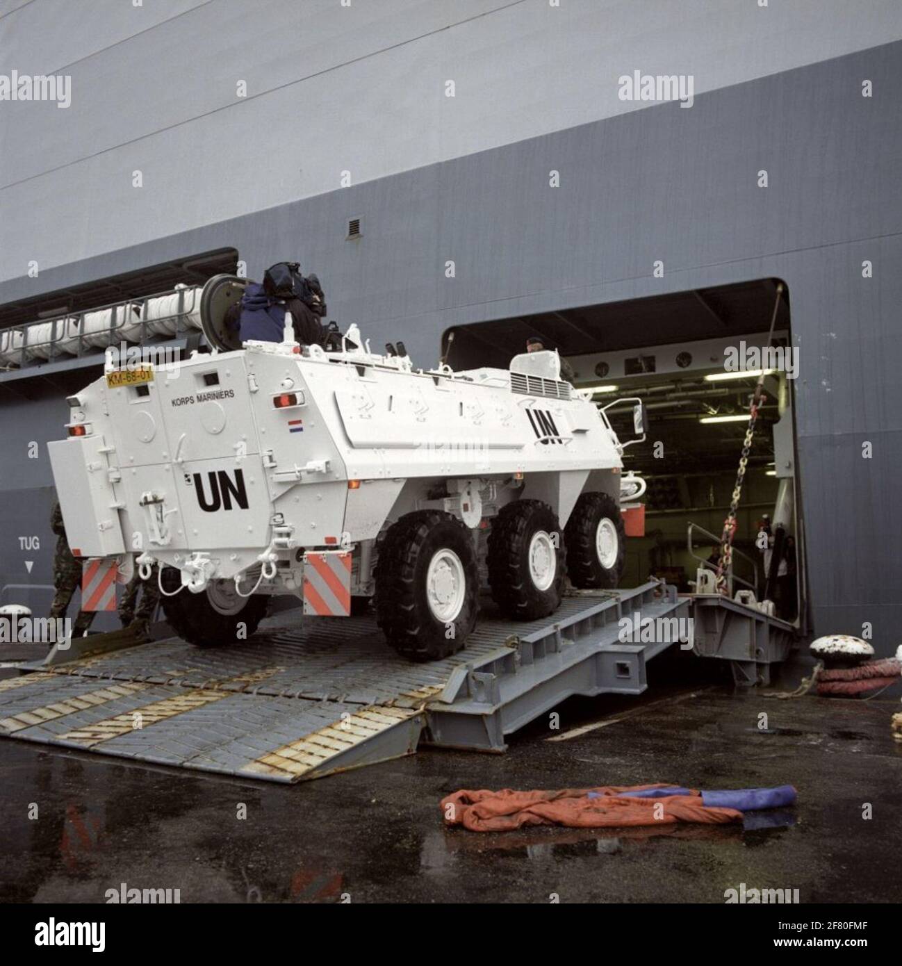 An armored vehicle drives the amphibious transport ship Hr.Ms ...