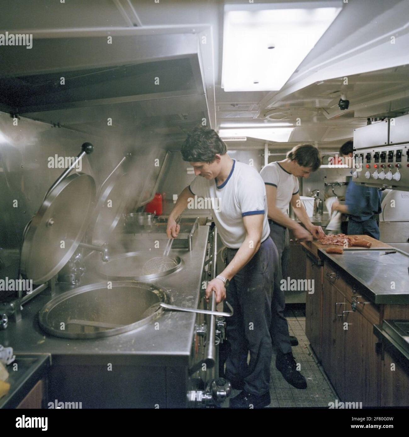 Chefs at work aboard the mine hunter Hr.Ms. Hellevoetsluis Stock Photo ...
