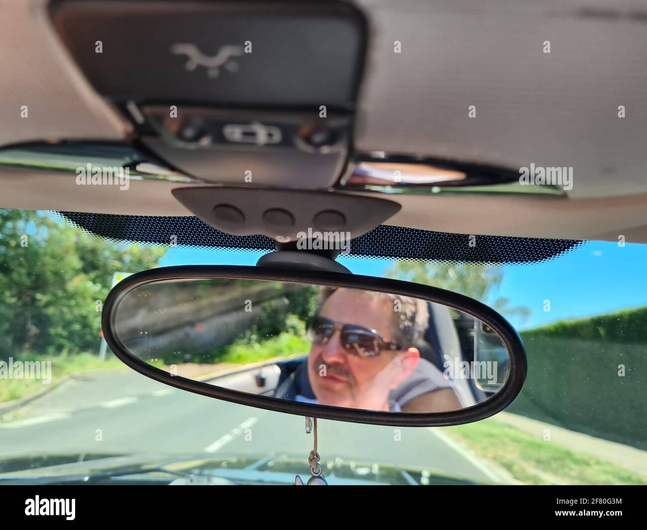Eyes in rearview mirror hi-res stock photography and images - Alamy