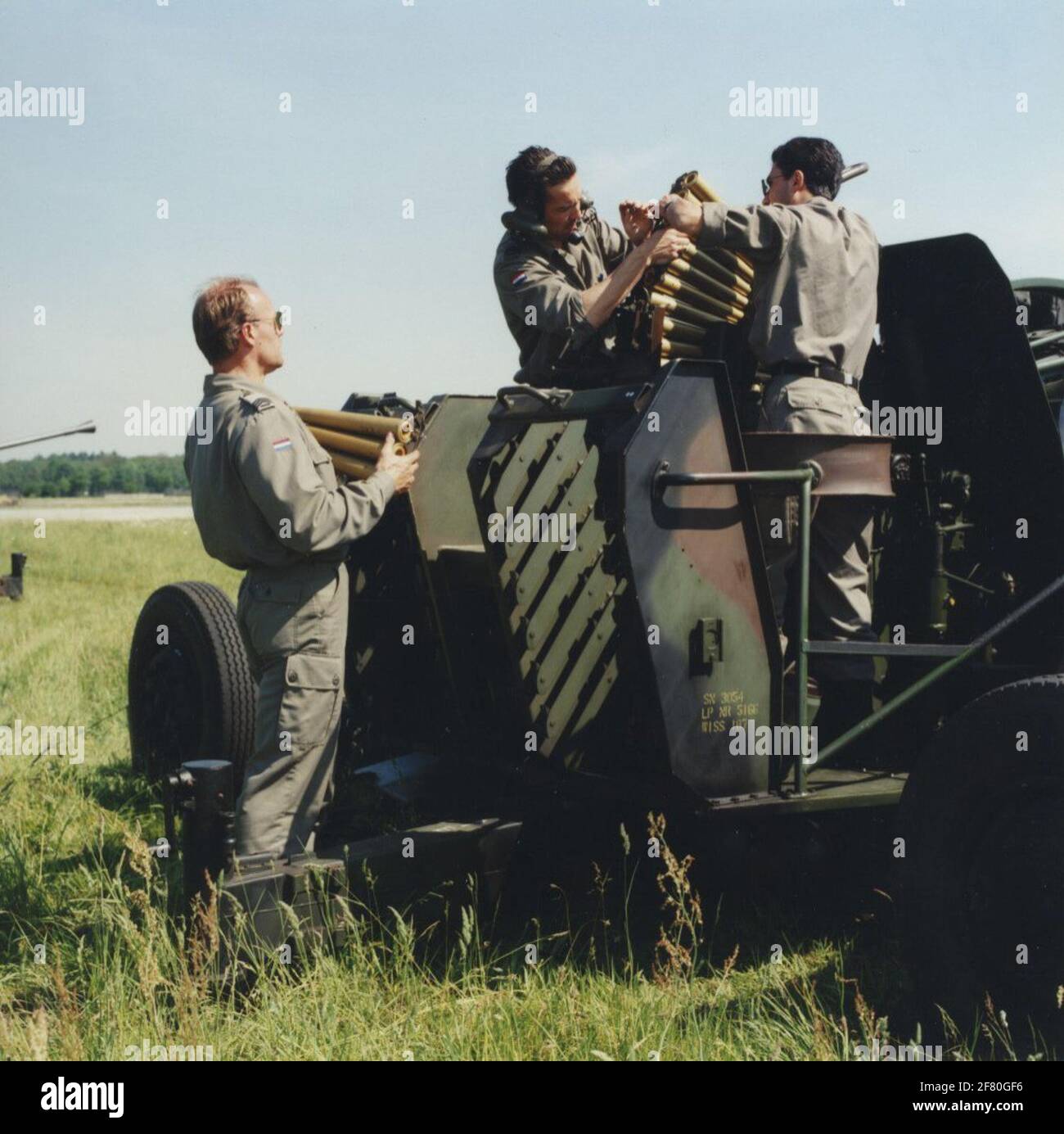 Clips with grenades are placed on a Bofors 40mm L70 air purpose gun ...