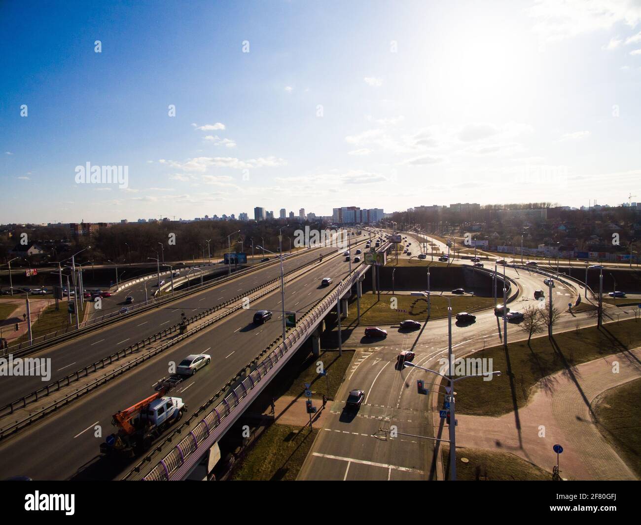 Aerial view at junctions of city highway. Vehicles drive on roads ...