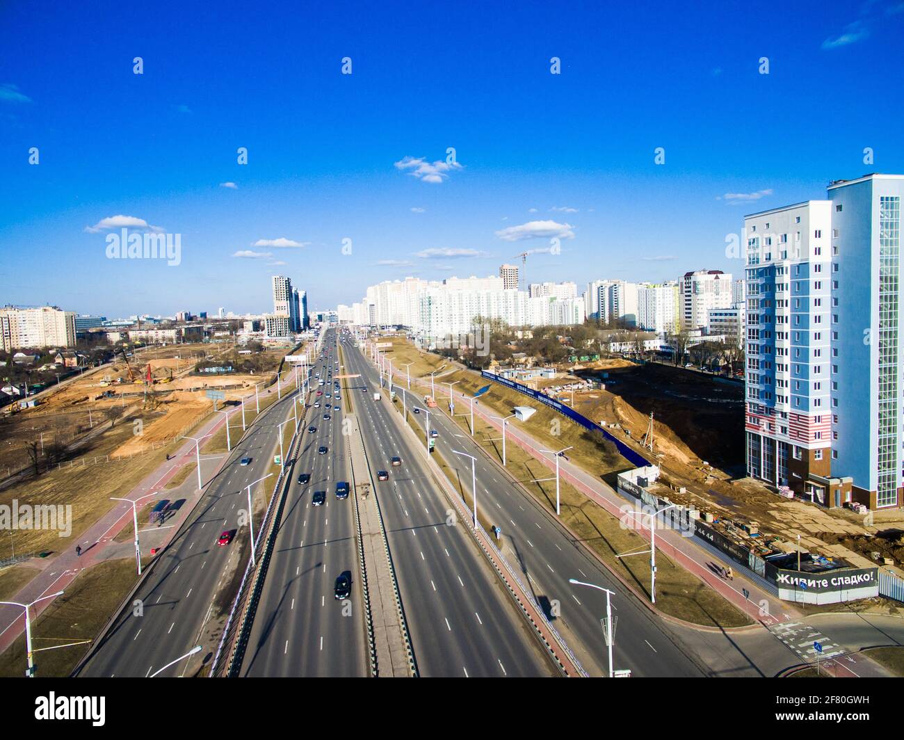Aerial view at junctions of city highway. Vehicles drive on roads ...