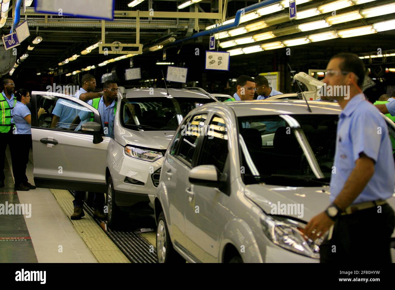 salvador, bahia / brazil - december 12, 2013: employees are seen at ...