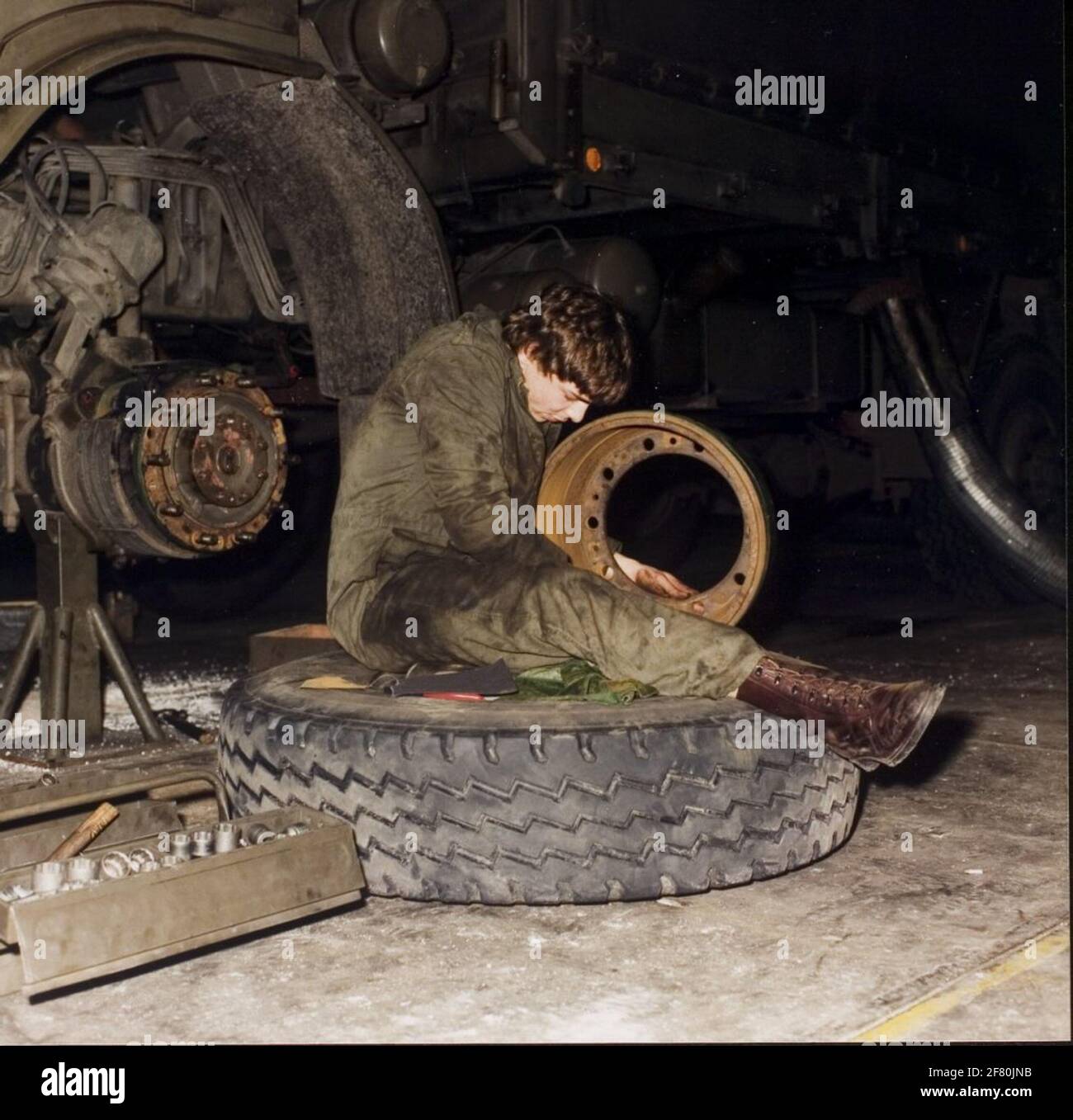 A technical service engineer performs maintenance work on the left ...