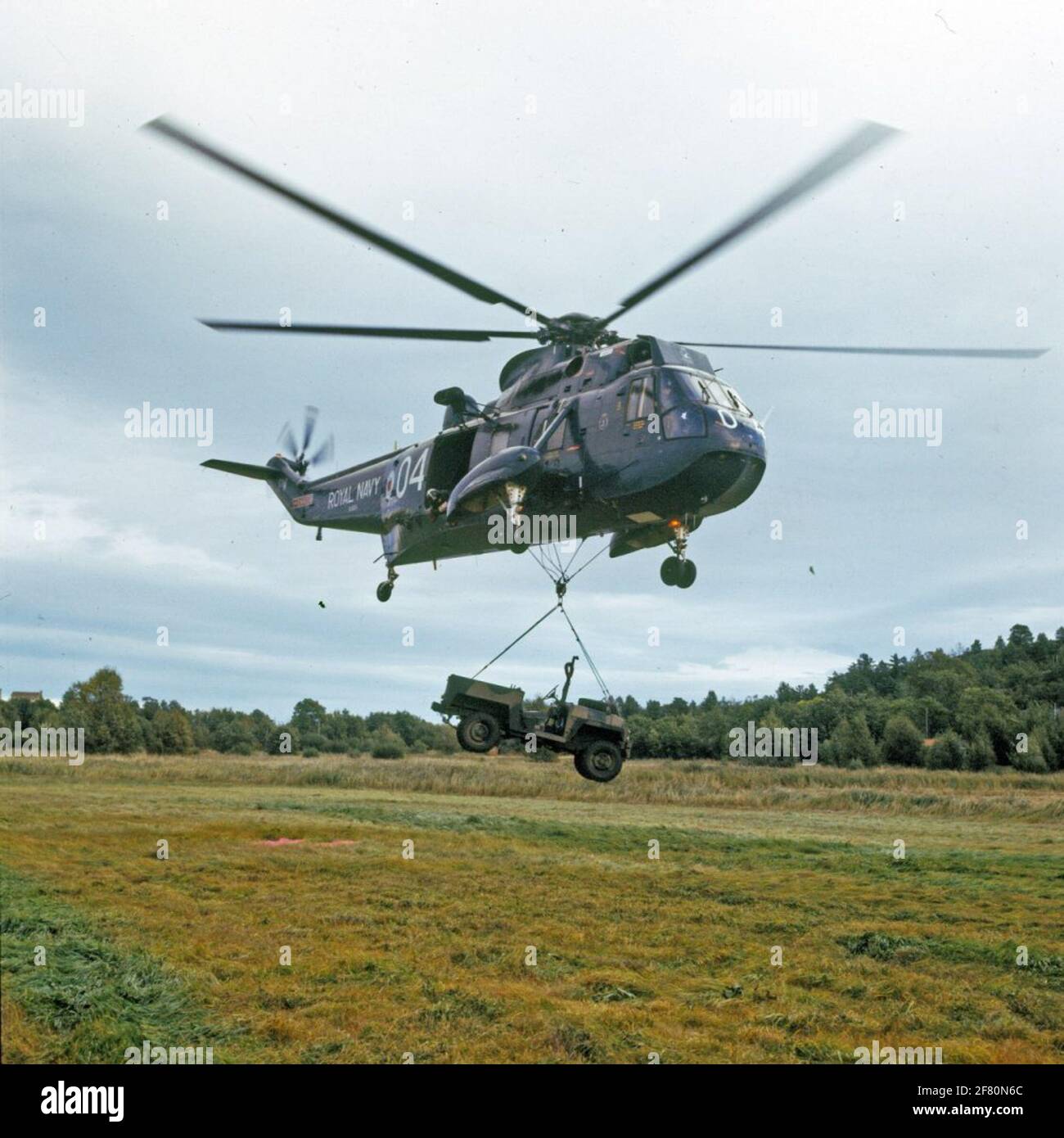 A British Westland Sea King Helicopter transports a jeep Stock Photo ...