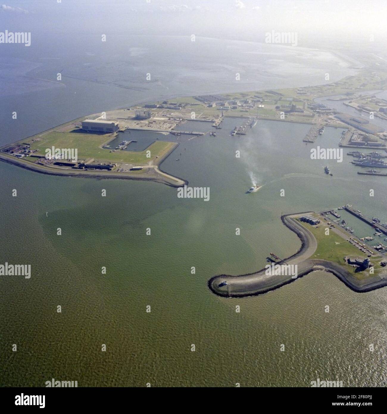 Aerial view of a part of the port of Den Helder (March 1990) with O.A ...