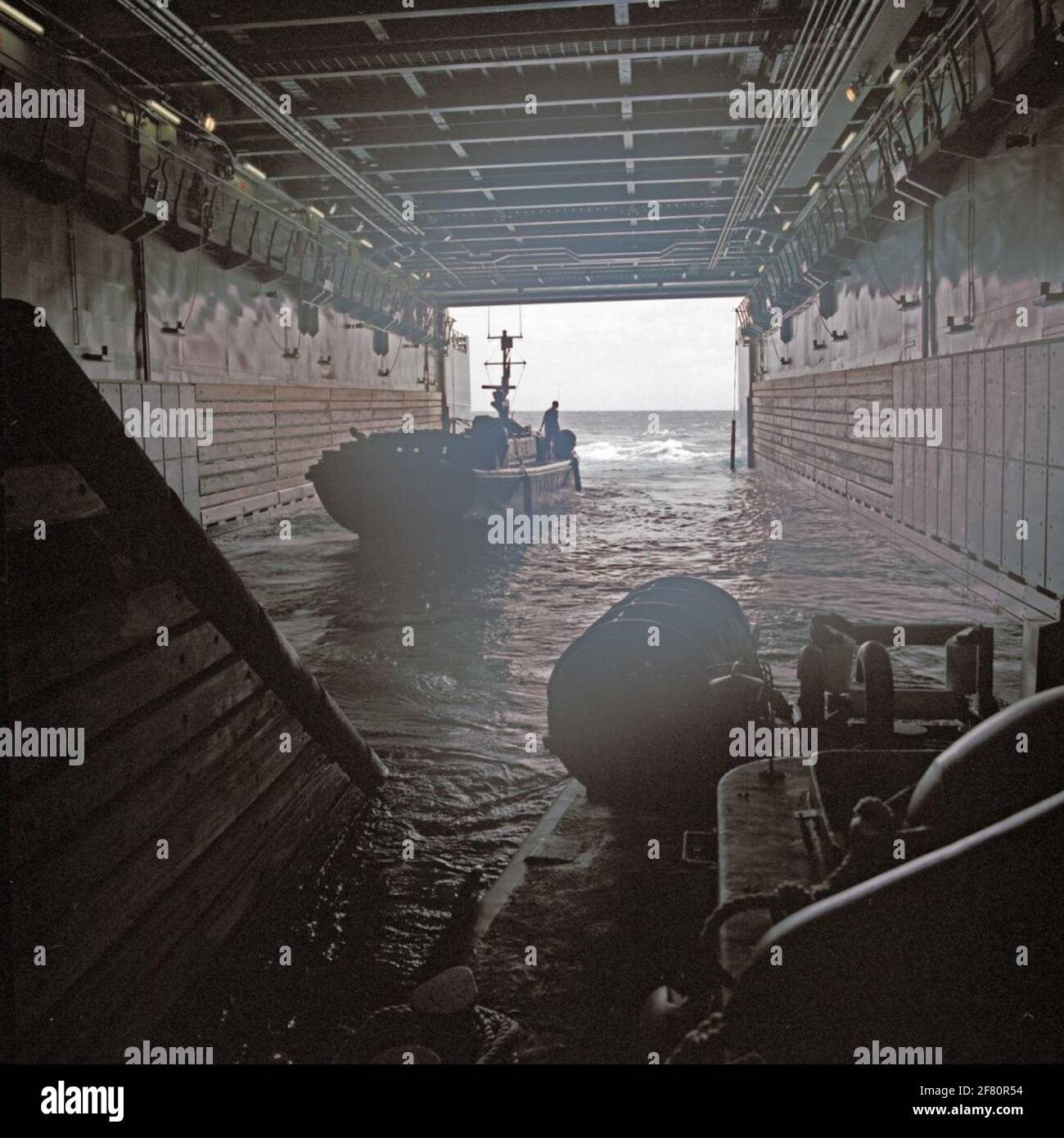 A landing craft sails the amphibious transport ship Hr.Ms. Rotterdam ...