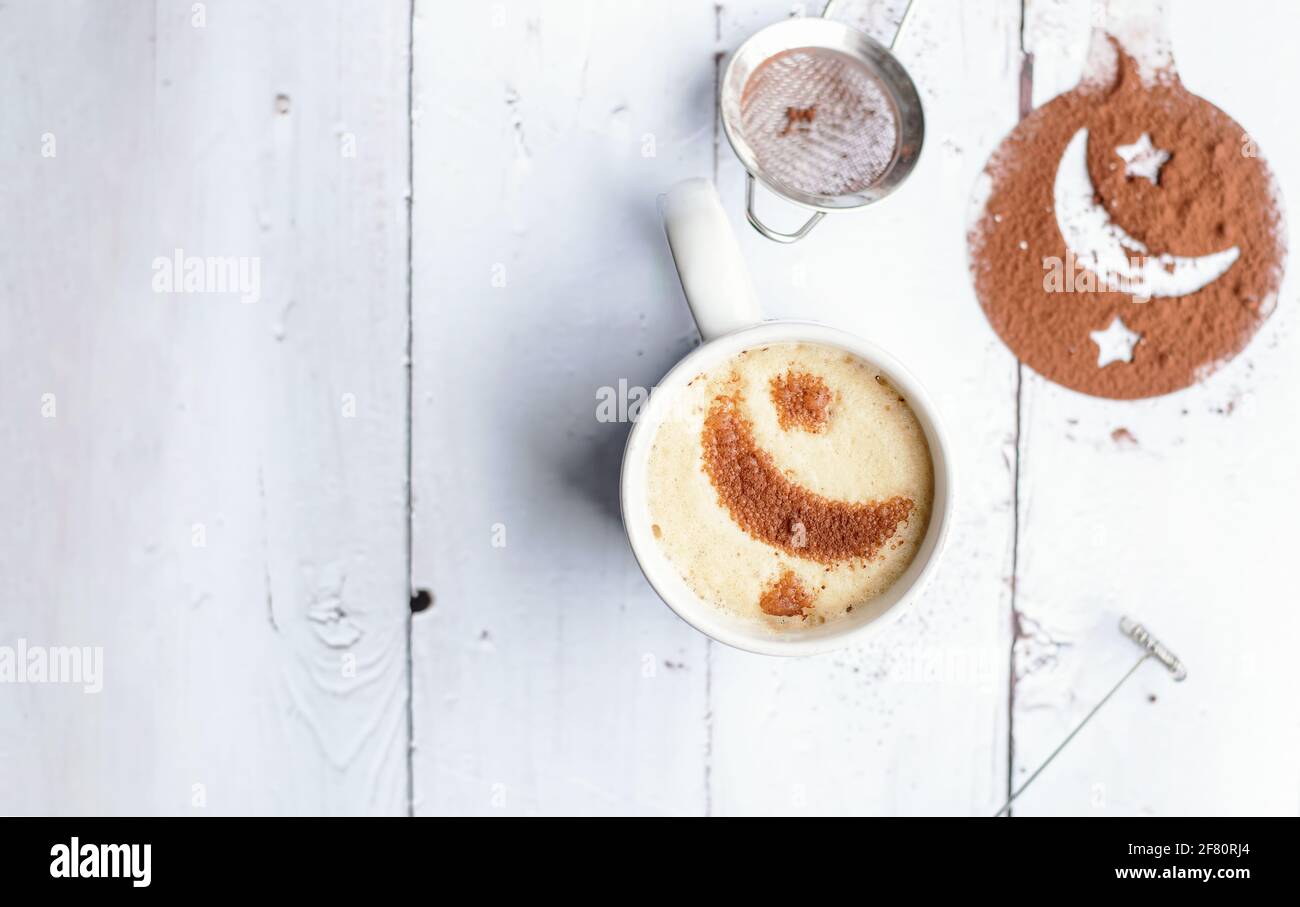 Homemade latte with moon art and utensils lying around Stock Photo - Alamy