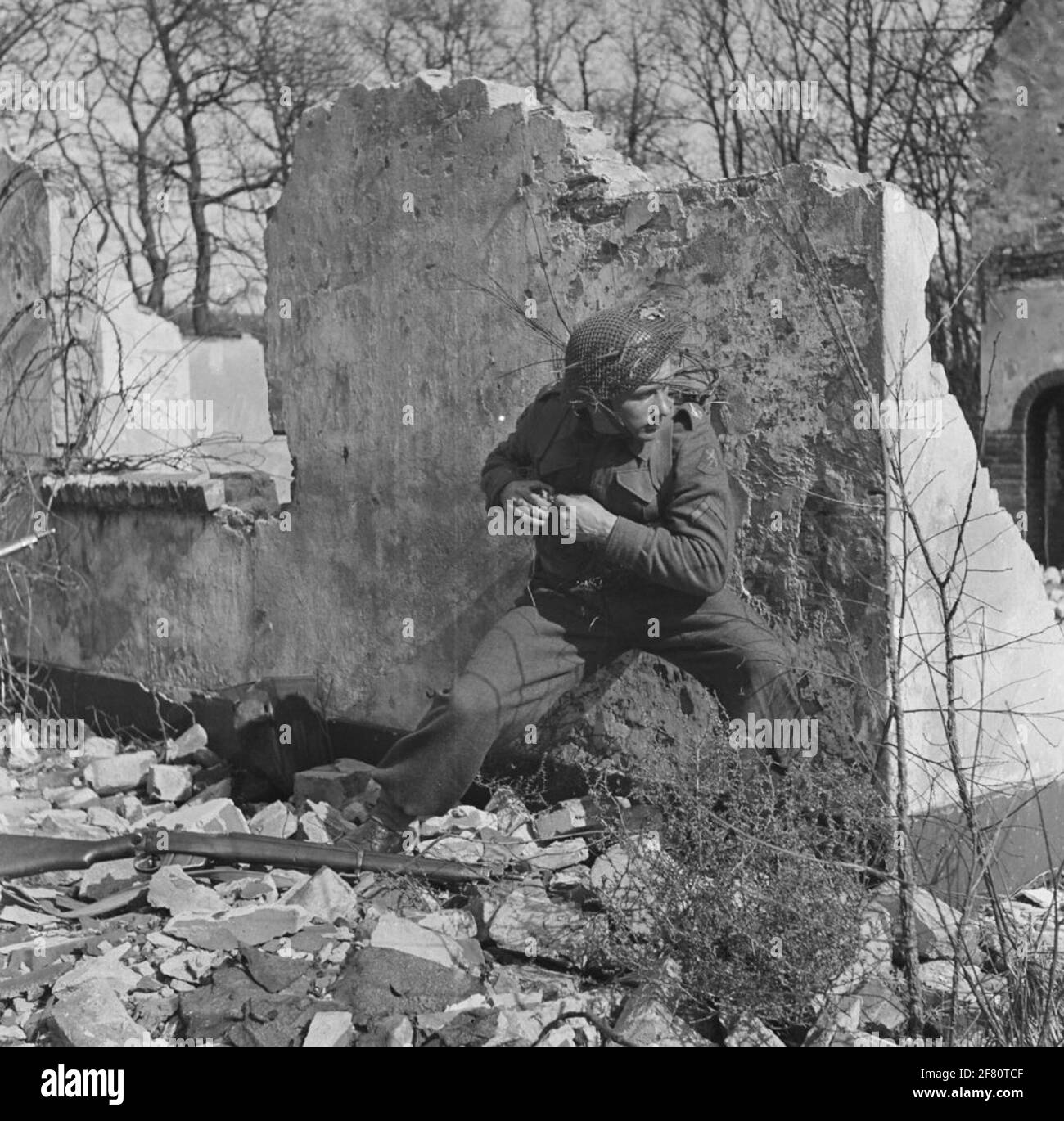 An infanterist ready to throw a (exercise) hand grenade Stock Photo - Alamy