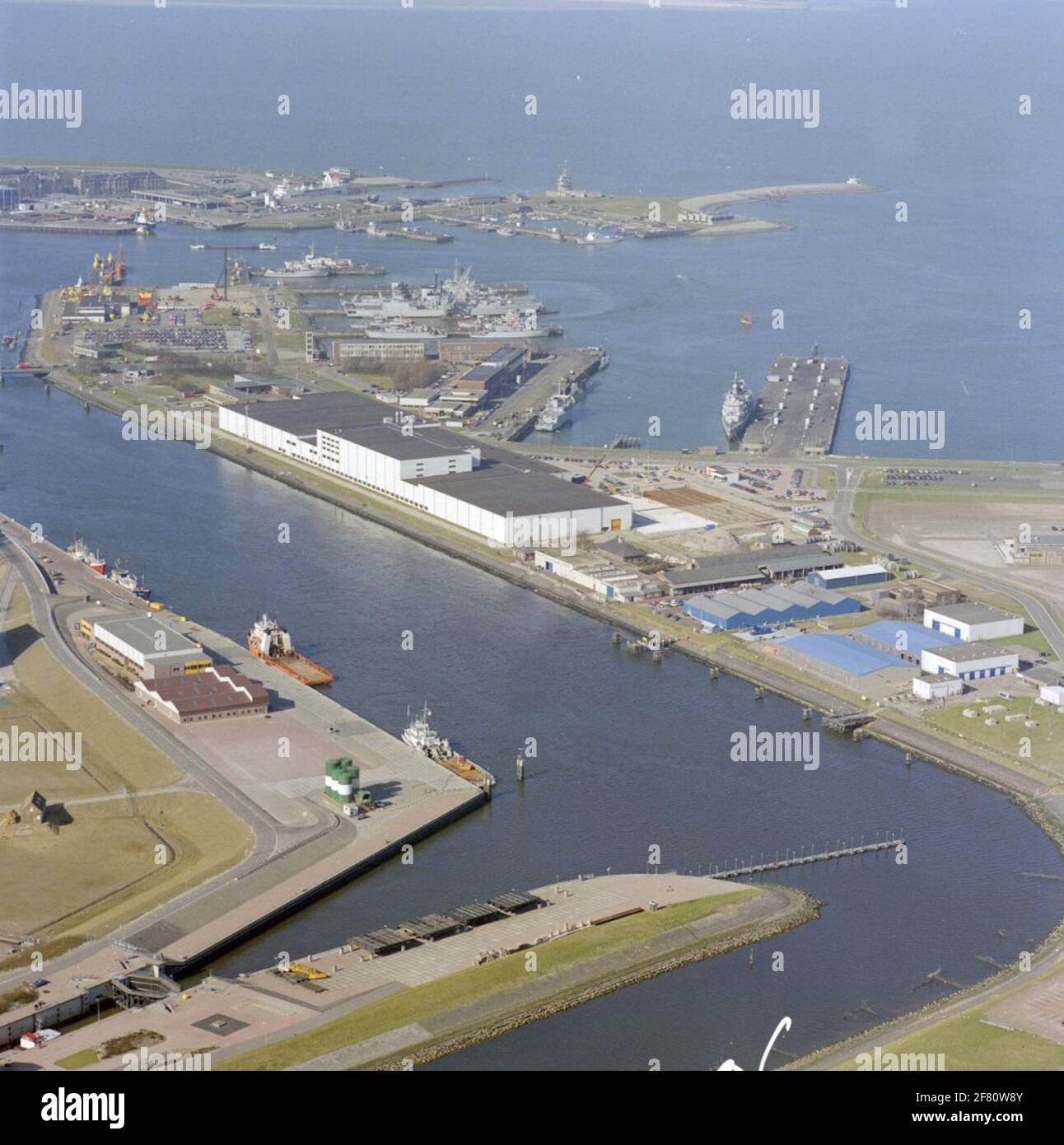 Aerial view of a part of the port of Den Helder (March 1990) with some ...