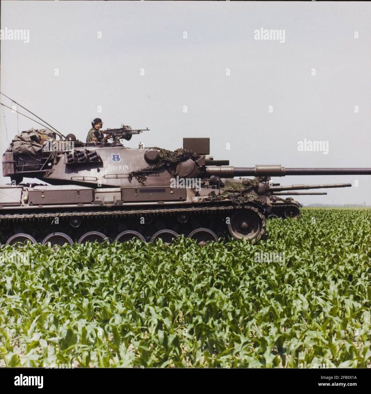Leopard 1 tanks drive through a field during an exercise in West ...