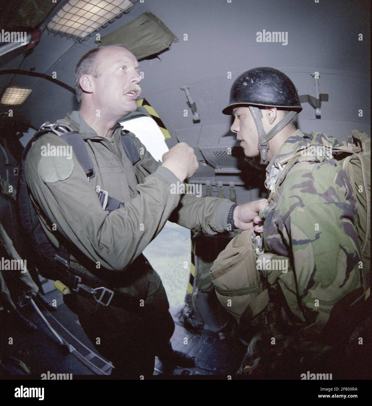 An instructor gives some final directions for a parachutist De Sprong ...