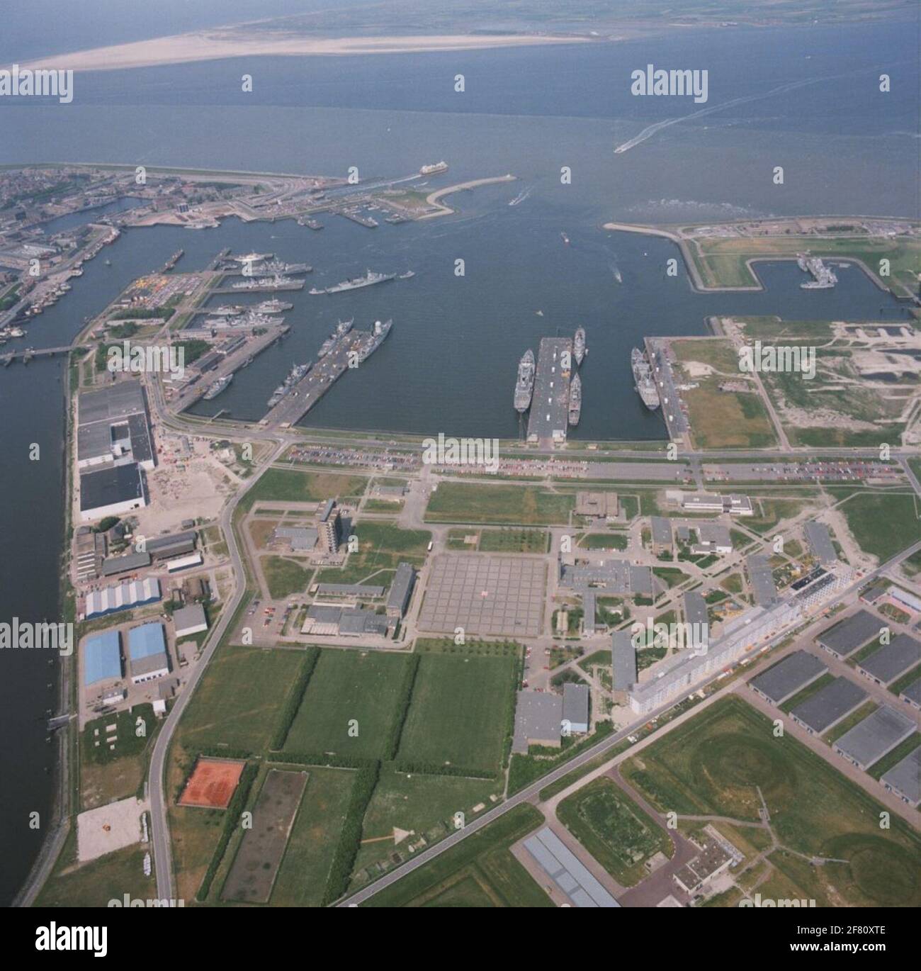 Aerial recording of the Den Helder marine complex. Various navy ships ...