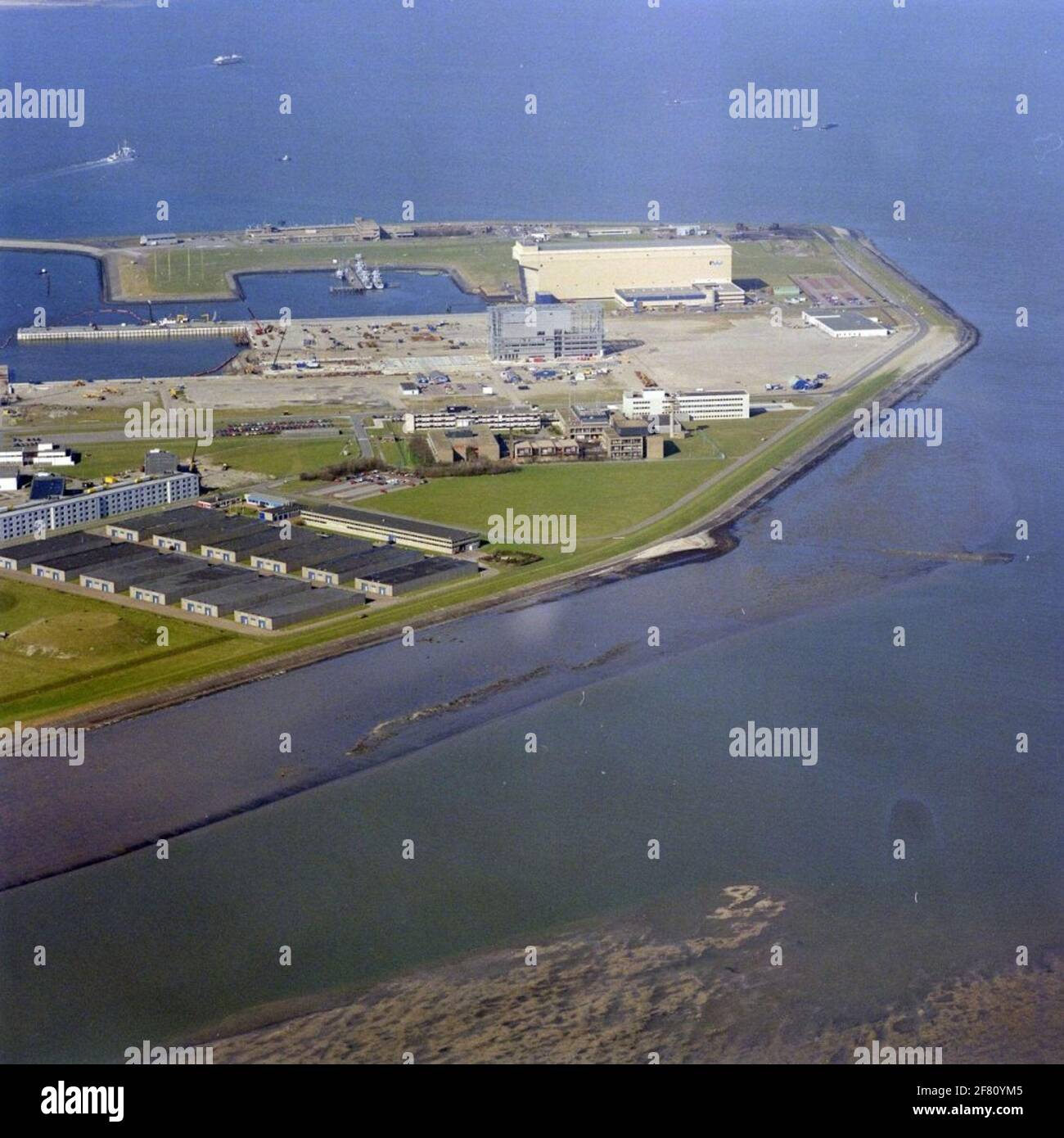 Aerial view of a part of the port of Den Helder (March 1990) with O.A ...