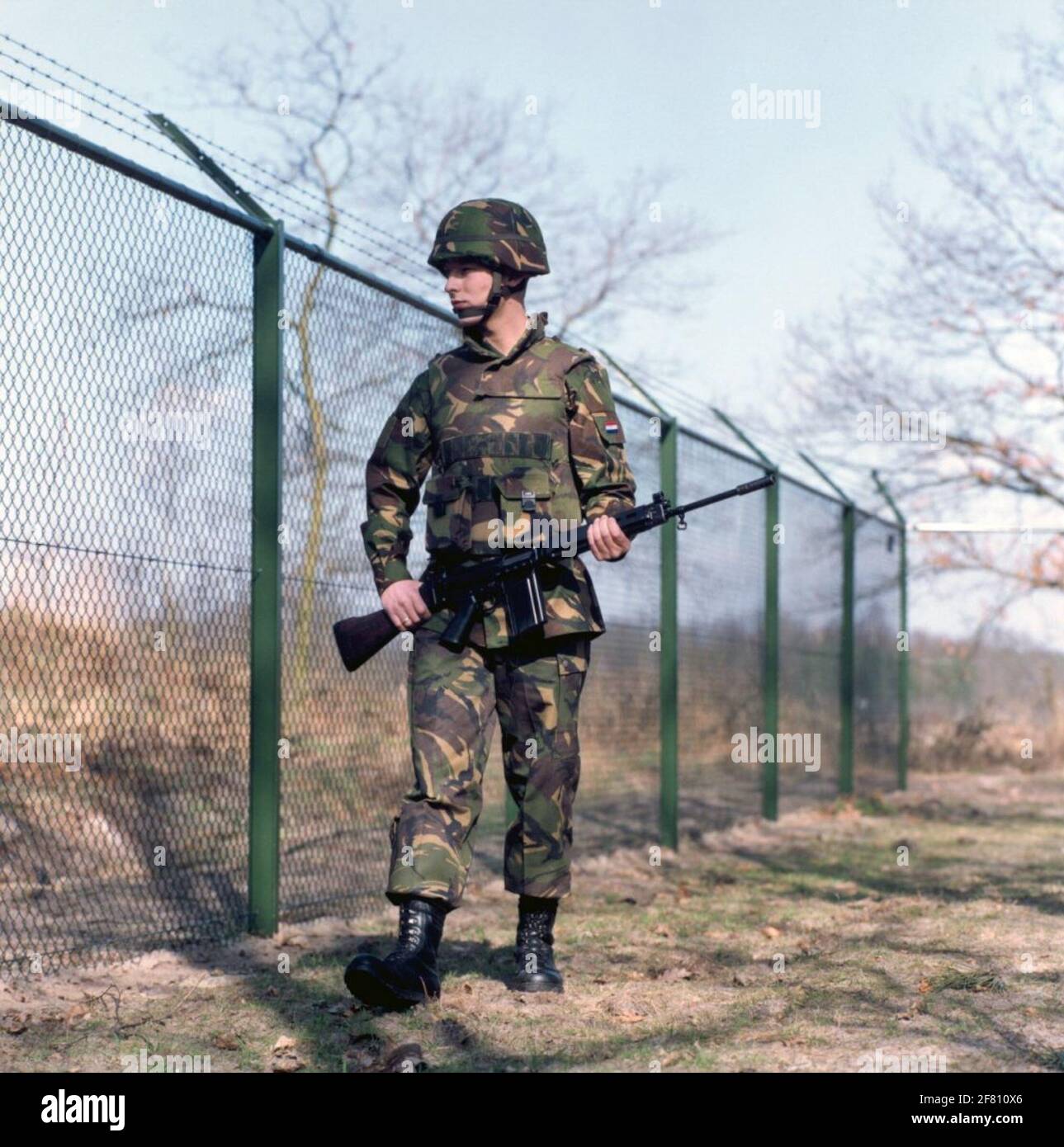 A soldier in combat studs and with the type of helmet entered at the ...