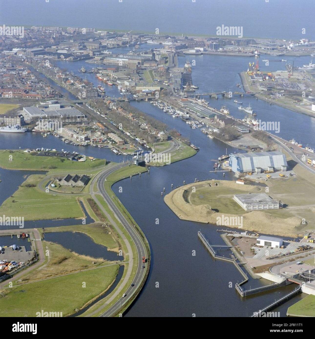 Aerial view of a part of the port of Den Helder (March 1990) with the ...