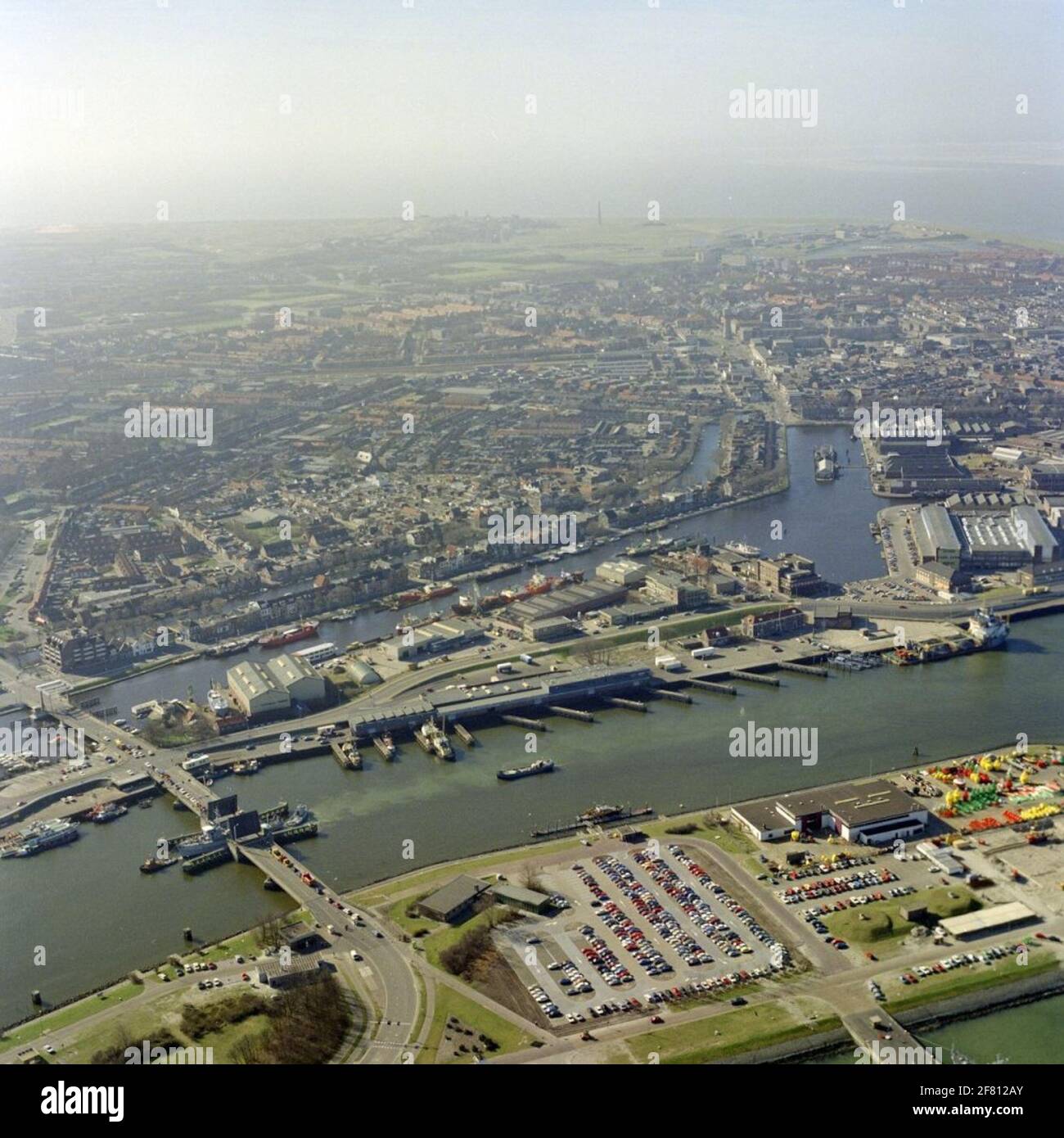 Aerial view of a part of the port of Den Helder (March 1990) with the ...