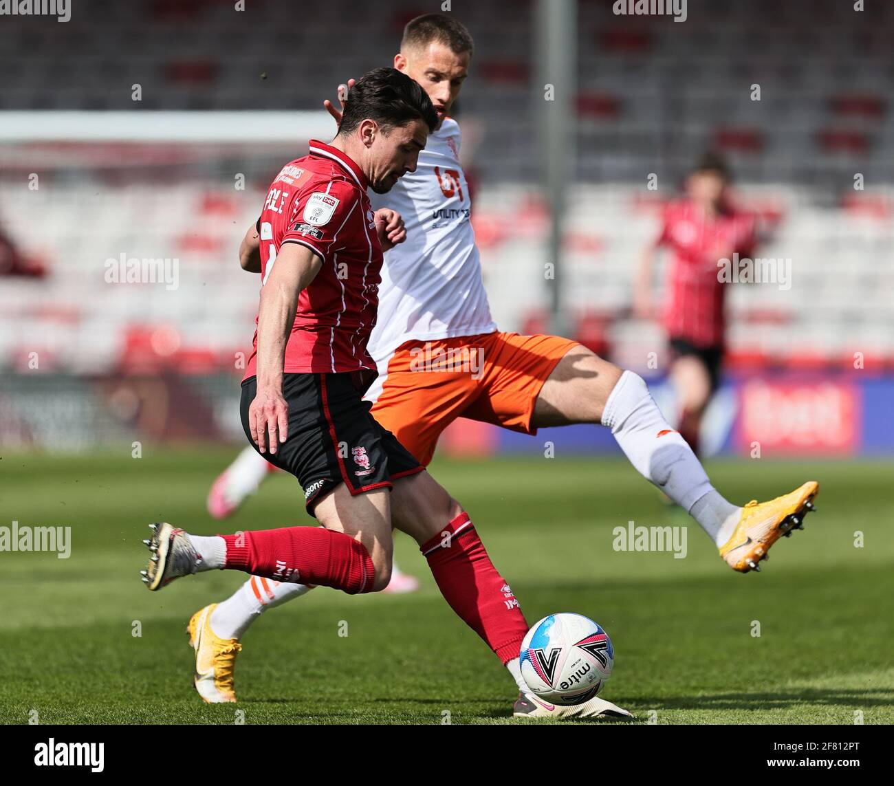 LINCOLN, UK. APRIL 10TH: Aaron Lewis of Lincoln City clears the ball ...