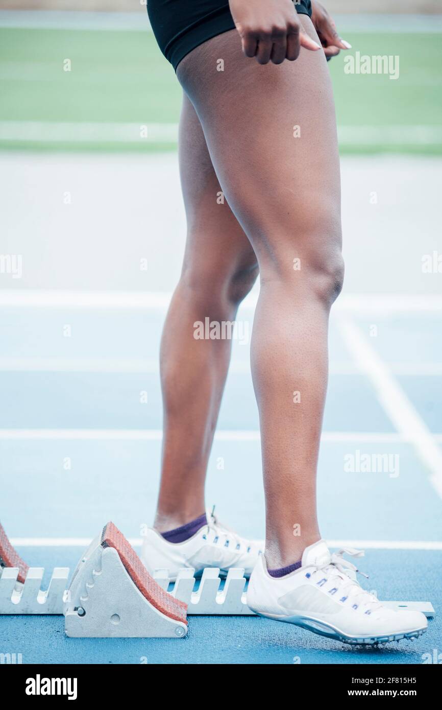 Female athlete in starting blocks hi-res stock photography and images ...
