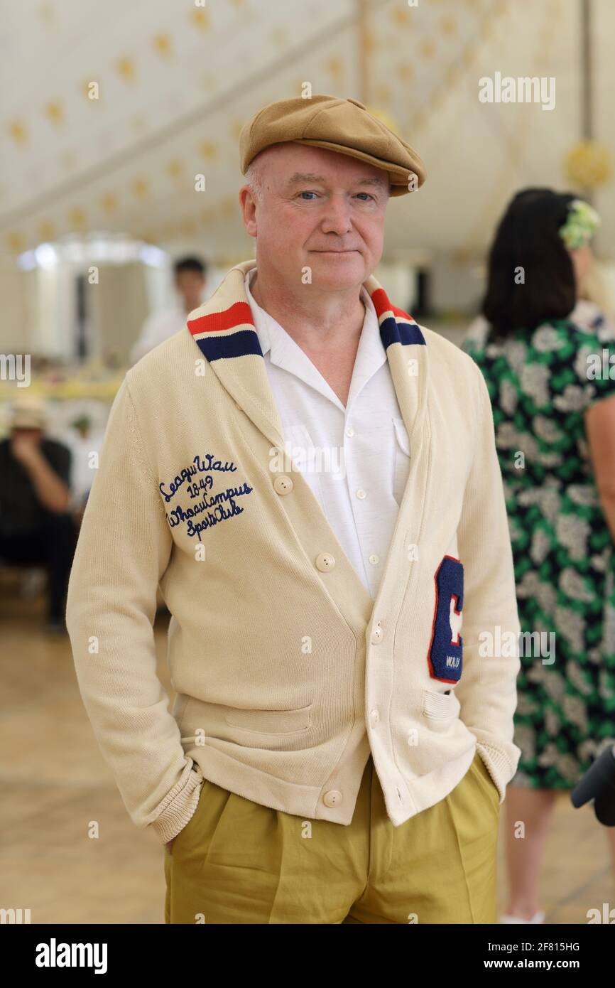 Spectators and show people are dressed in vintage Goodwood Revival ...