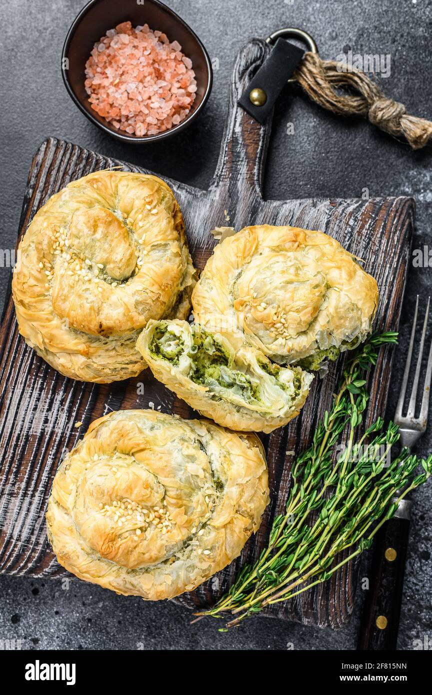 Baked Spanakopita spiral filo pastry puff pie with feta cheese and ...