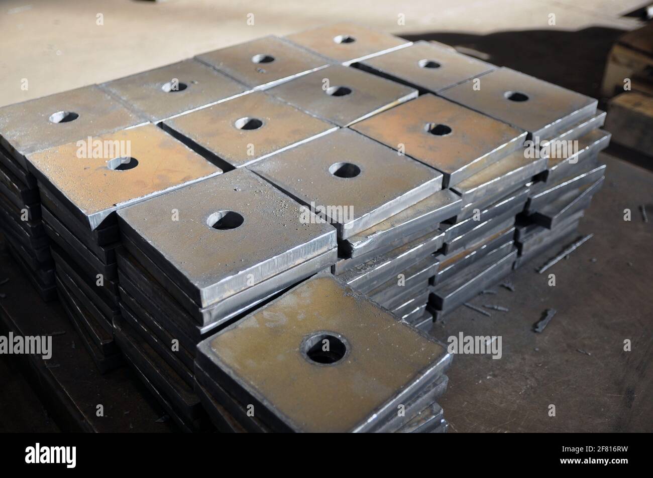 Plasma cutting of metal. Storing finished parts with a hole on a pallet ...