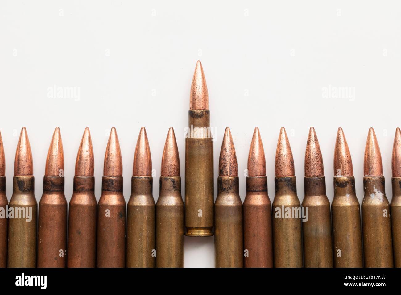 Close up of a line of bullets against a white background Stock Photo ...