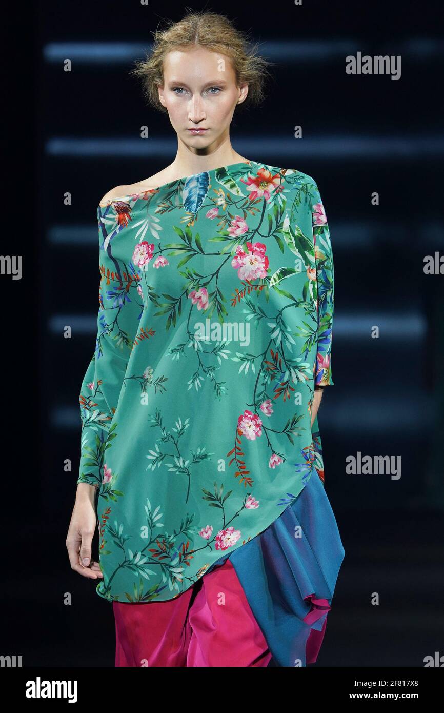 A model walks the runway at the Ulises Merida fashion show during ...