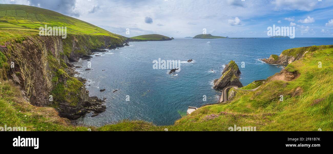 Beautiful panoramic shot of amazing Dunquin Pier and harbour with tall ...
