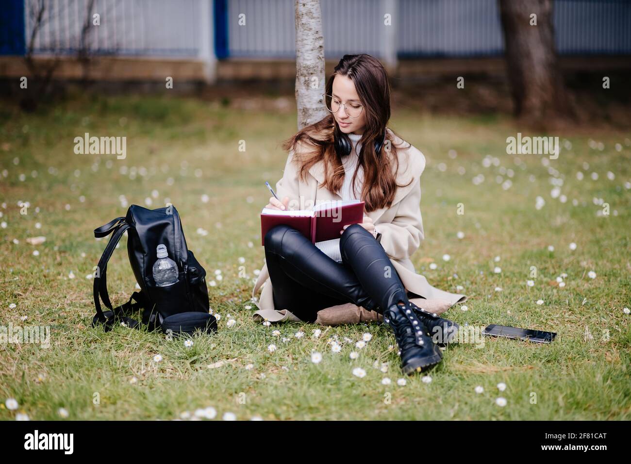 female student virtual learning on mobile internet outdoors Stock Photo ...