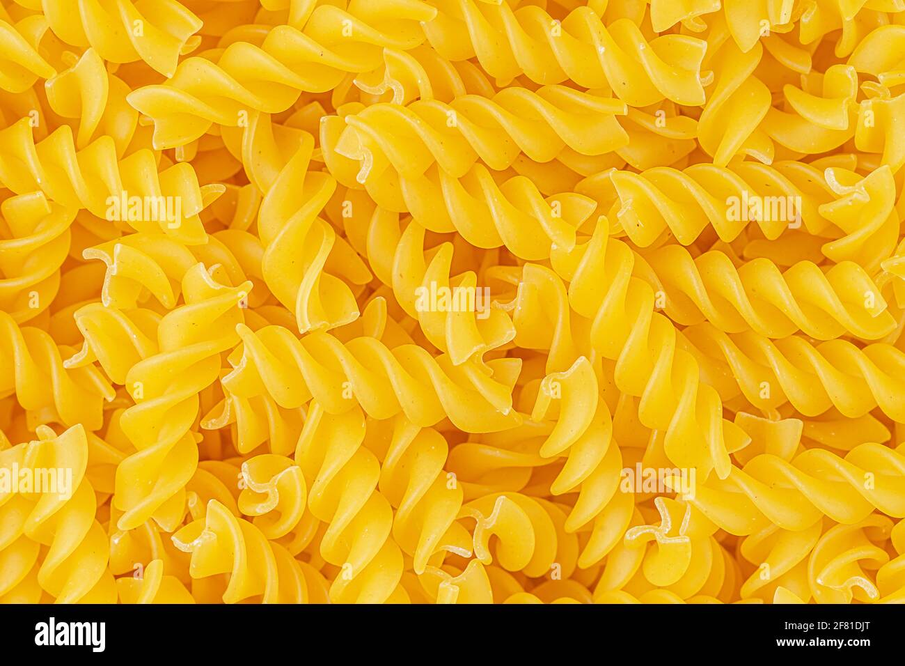 Italian whole grain pasta fusilli pattern. Top view Stock Photo - Alamy