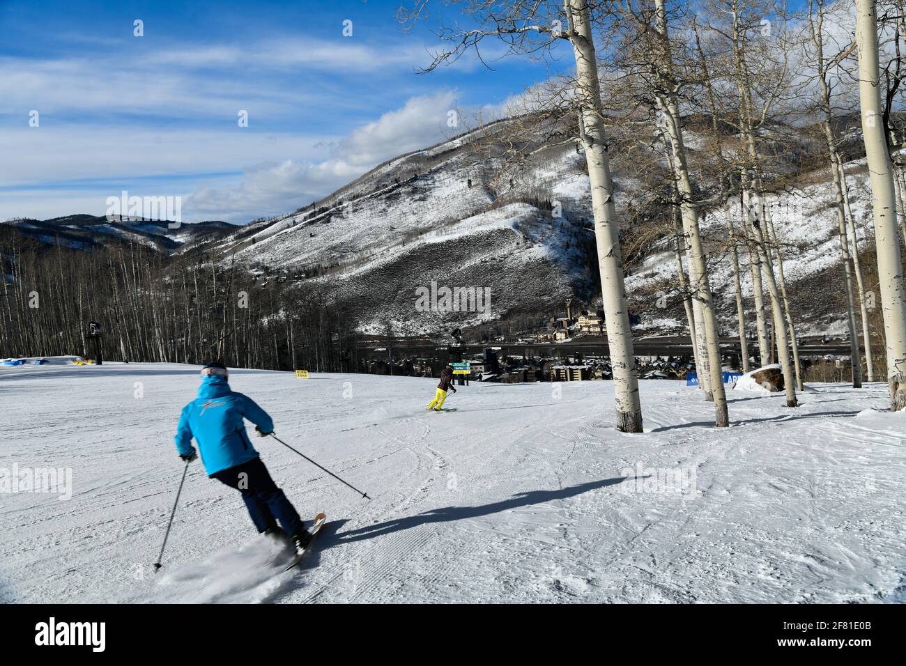 Back view of a man skiing down the slope in Vail Colorado, USA Stock ...