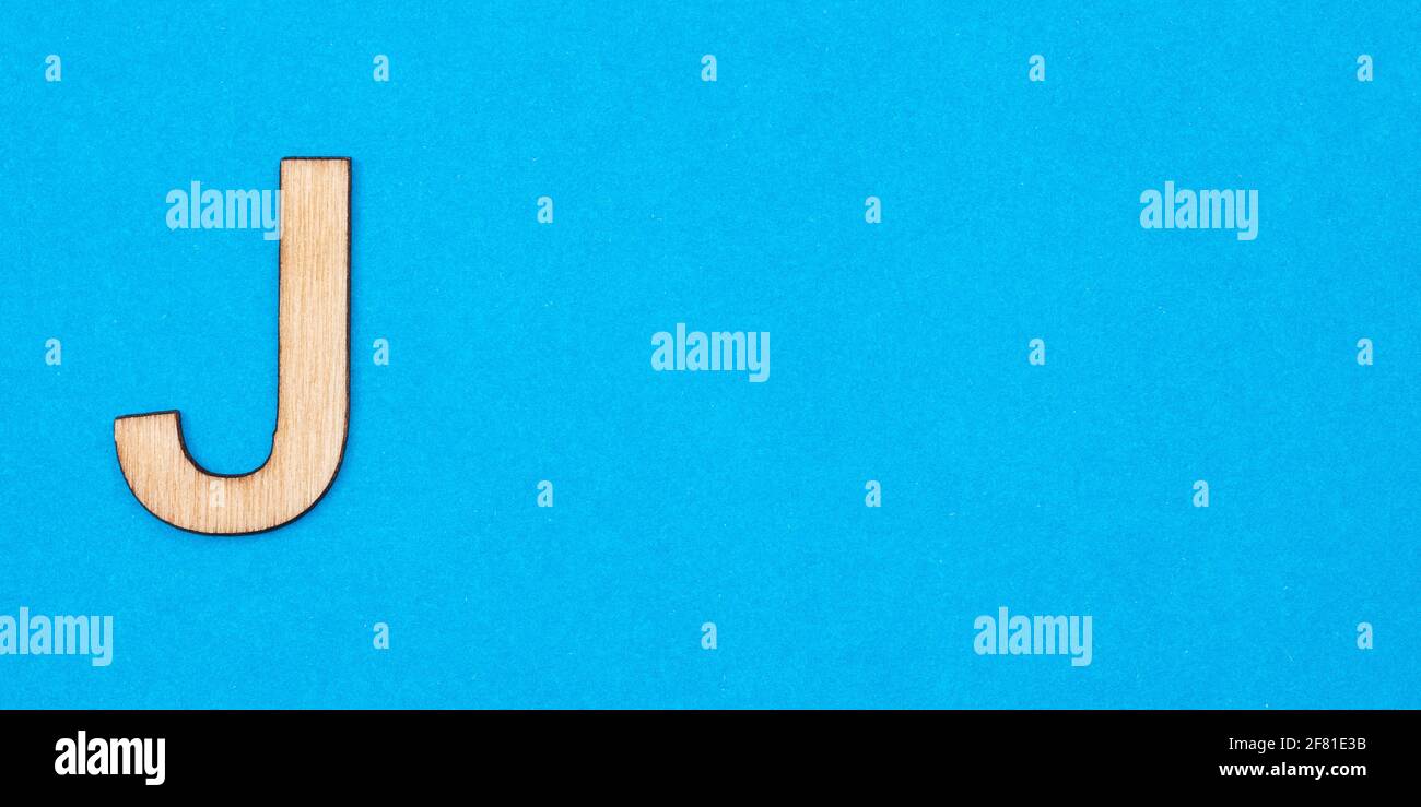 Letter J in white color on blue background Stock Photo - Alamy