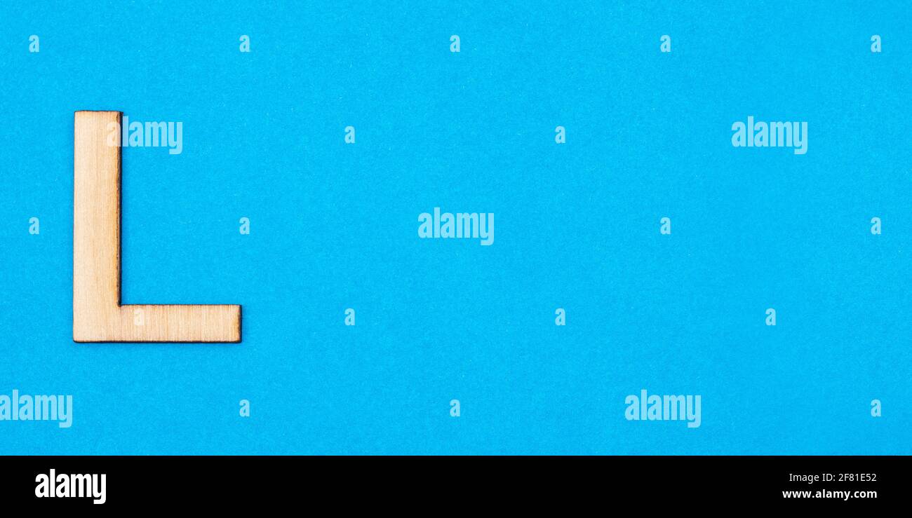 Letter L in white color on blue background Stock Photo - Alamy