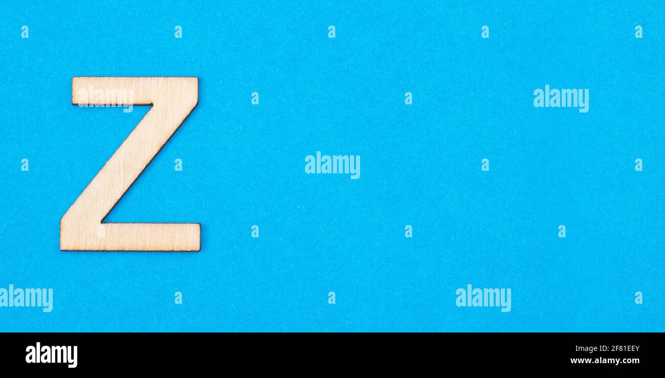 Letter Z in white color on blue background Stock Photo - Alamy