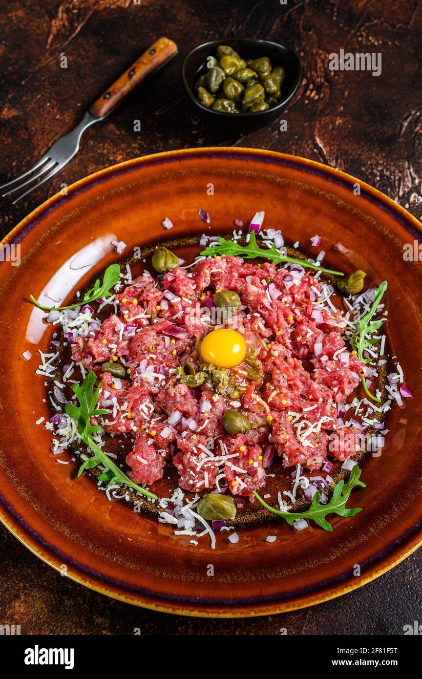Beef steak tartare with raw egg yolk, pickled capers and Parmesan ...